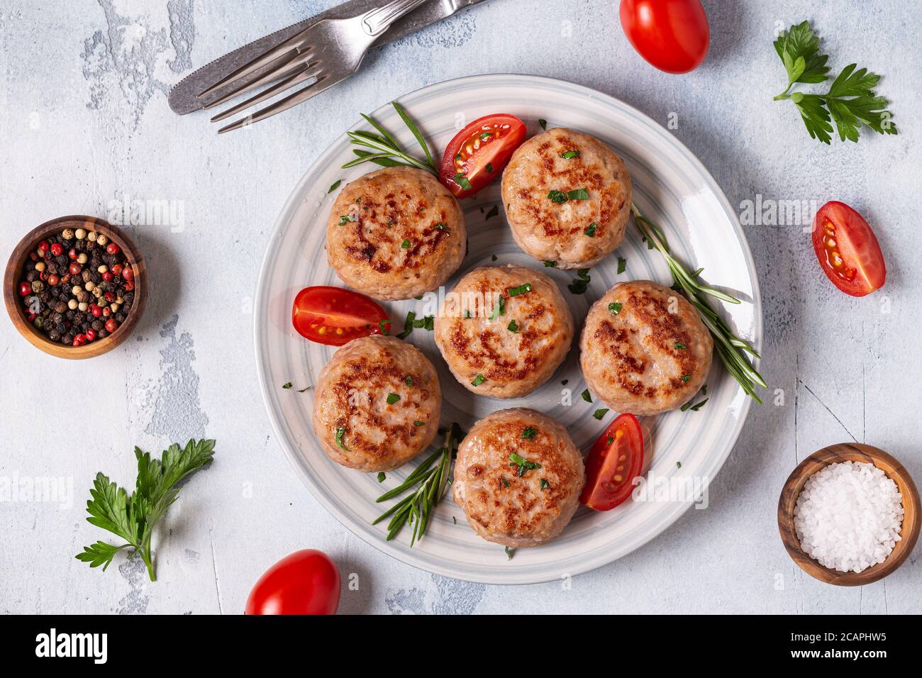 Fresh chiken cutlets with tomatoes and rosemary, top view Stock Photo ...