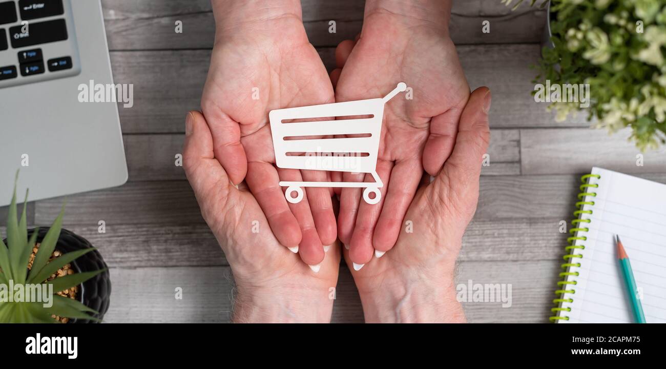 Concept of secure purchase with paper shopping cart in hands Stock ...