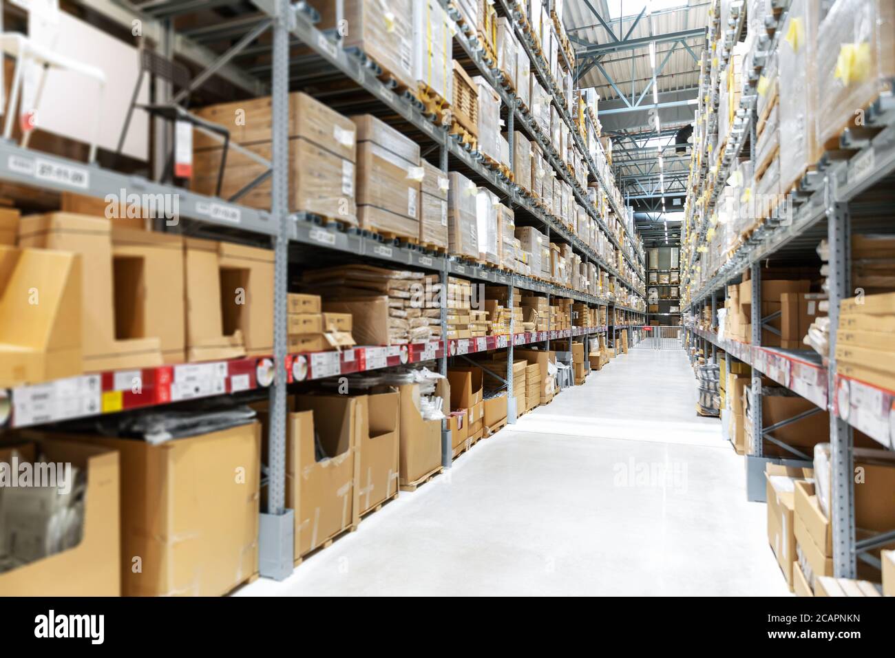 modern warehouse interior with boxes and goods in shelves Stock Photo ...