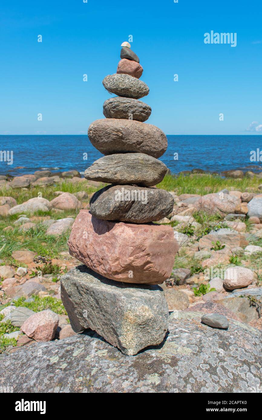 Stack of stones on stone sand beach with sea background. Zen garden ...