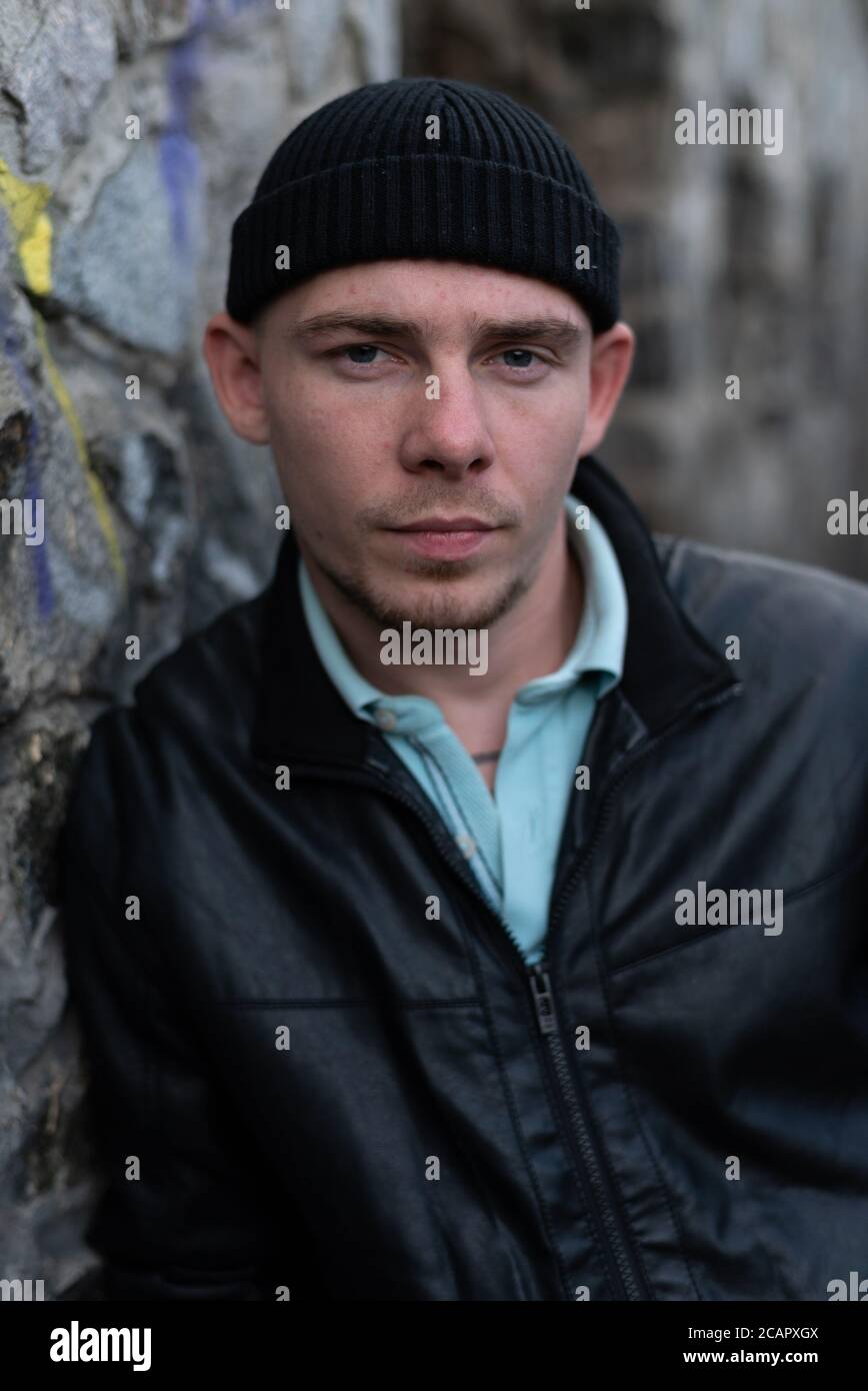 Bully criminal in black leather jacket Stock Photo - Alamy