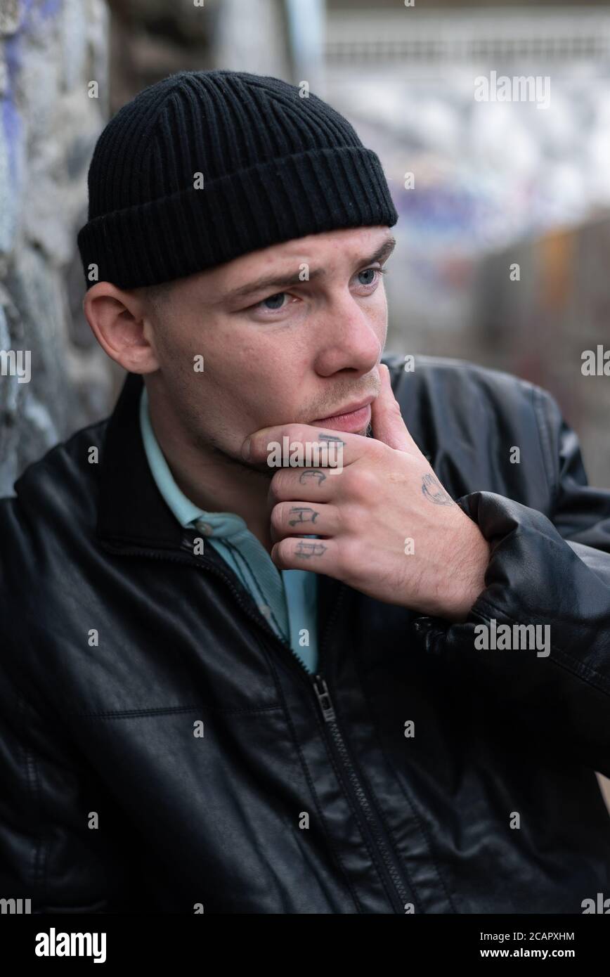 Bully criminal in black leather jacket Stock Photo - Alamy