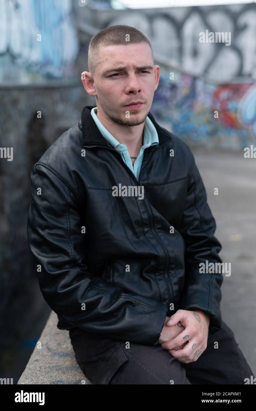 Bully criminal in black leather jacket Stock Photo - Alamy