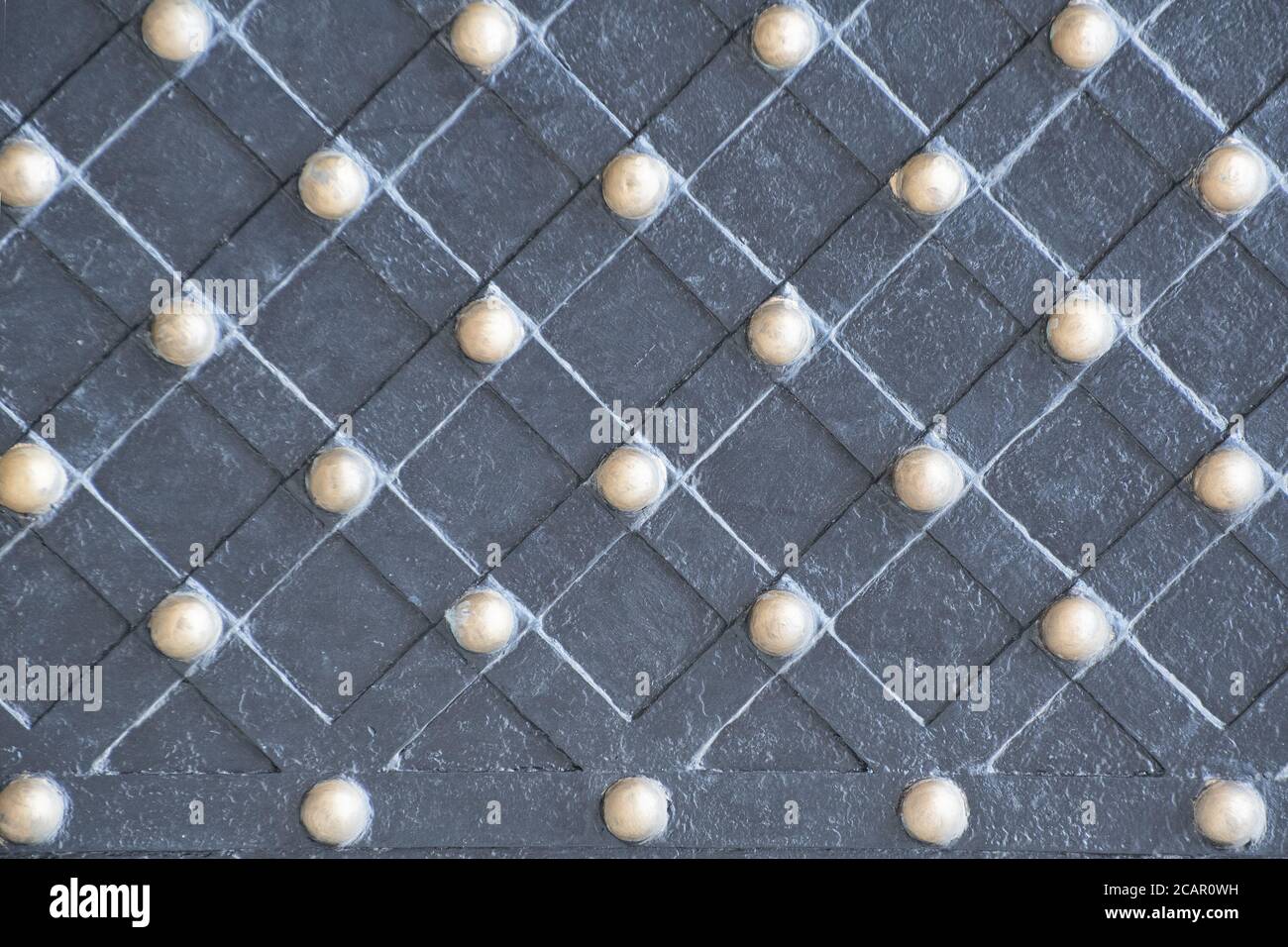 Forged stripes with shiny bronze rivets. Ancient gate element Stock ...