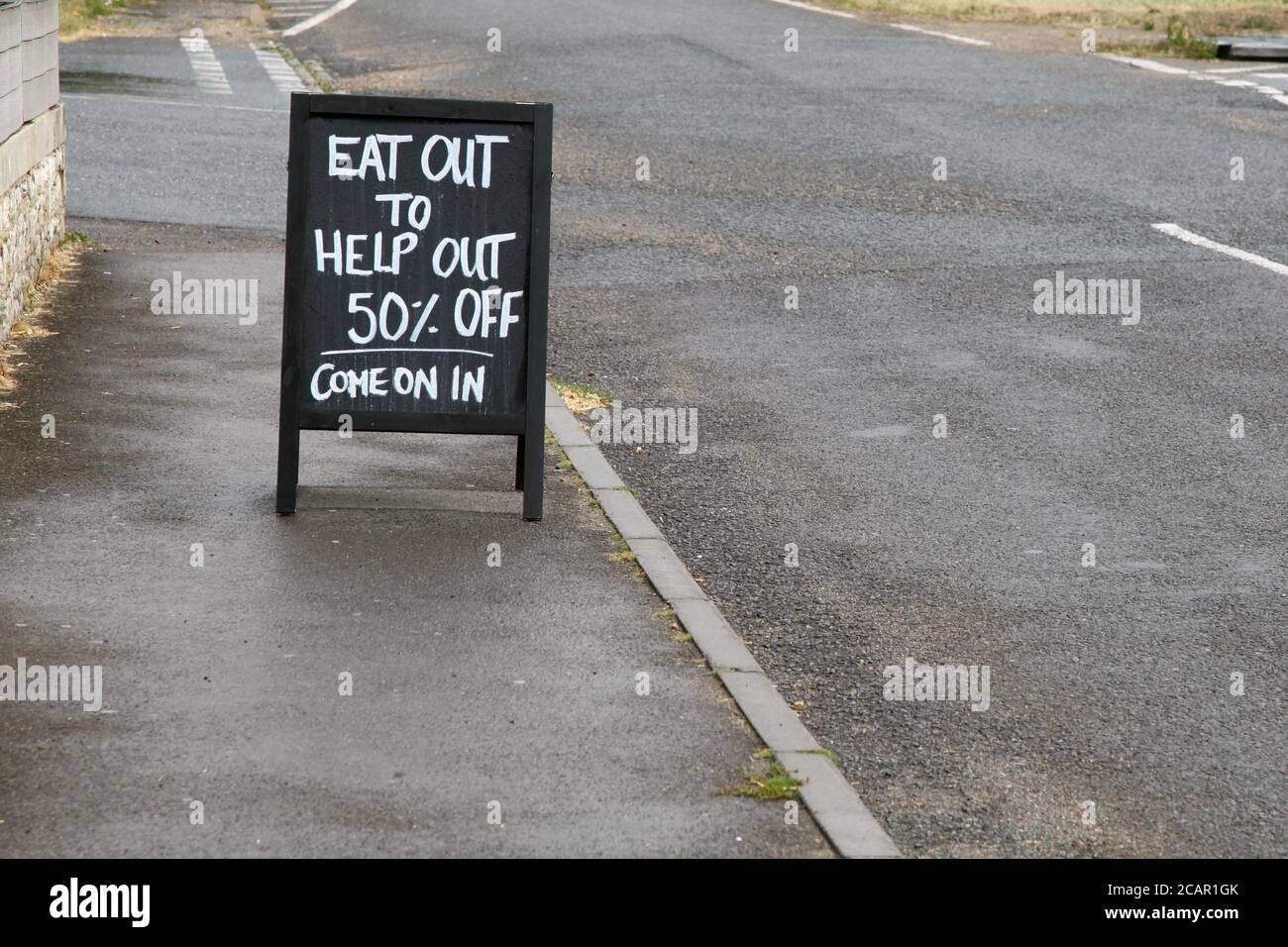 Eat Out to Help Out sign outside The Hen and Chicken roadside coaching ...