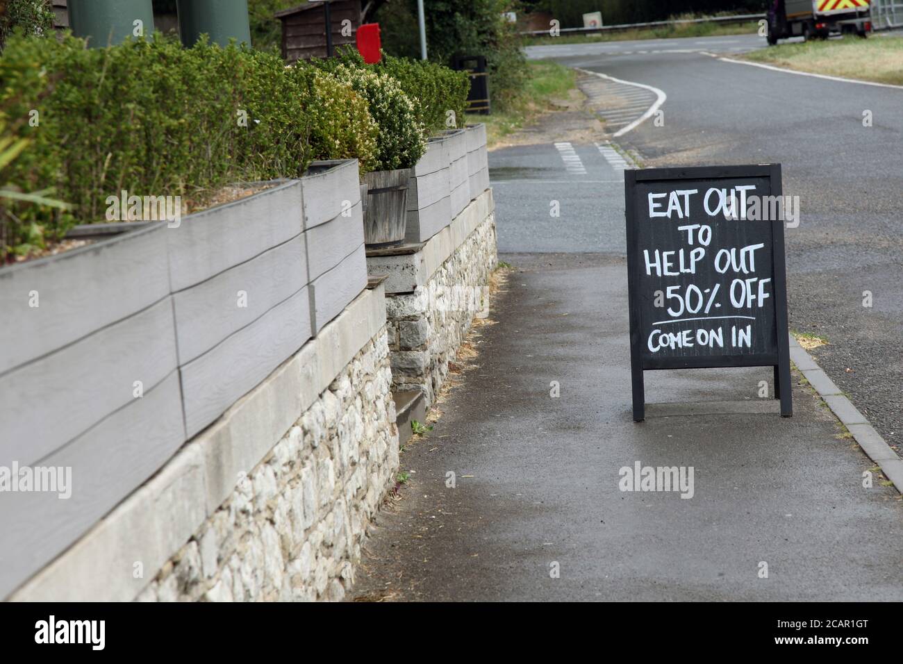 Eat Out to Help Out sign outside The Hen and Chicken roadside coaching ...