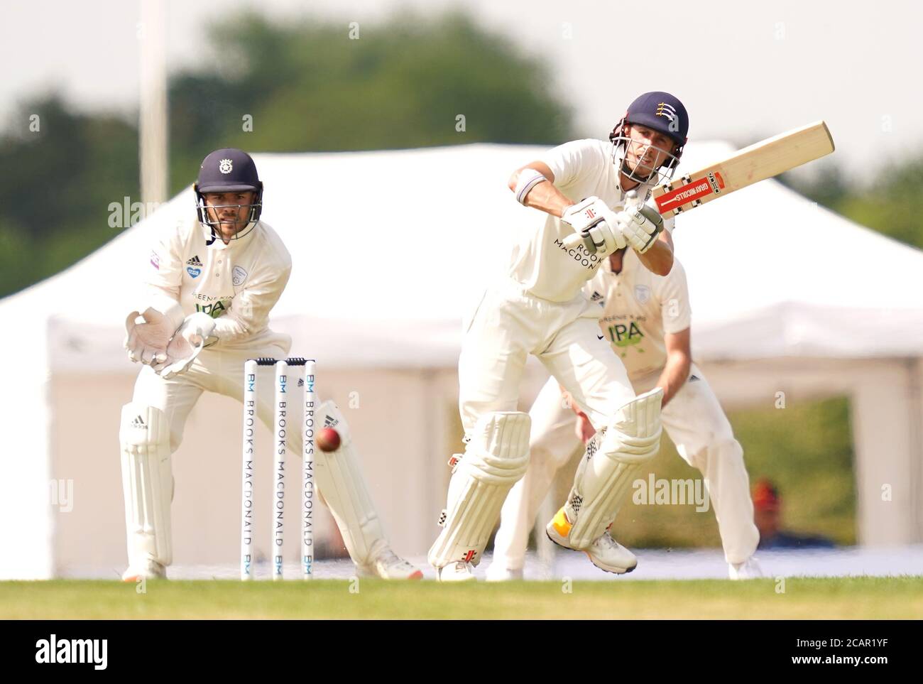 Middlesex's John Simpson (right) in action during day one of The Bob ...