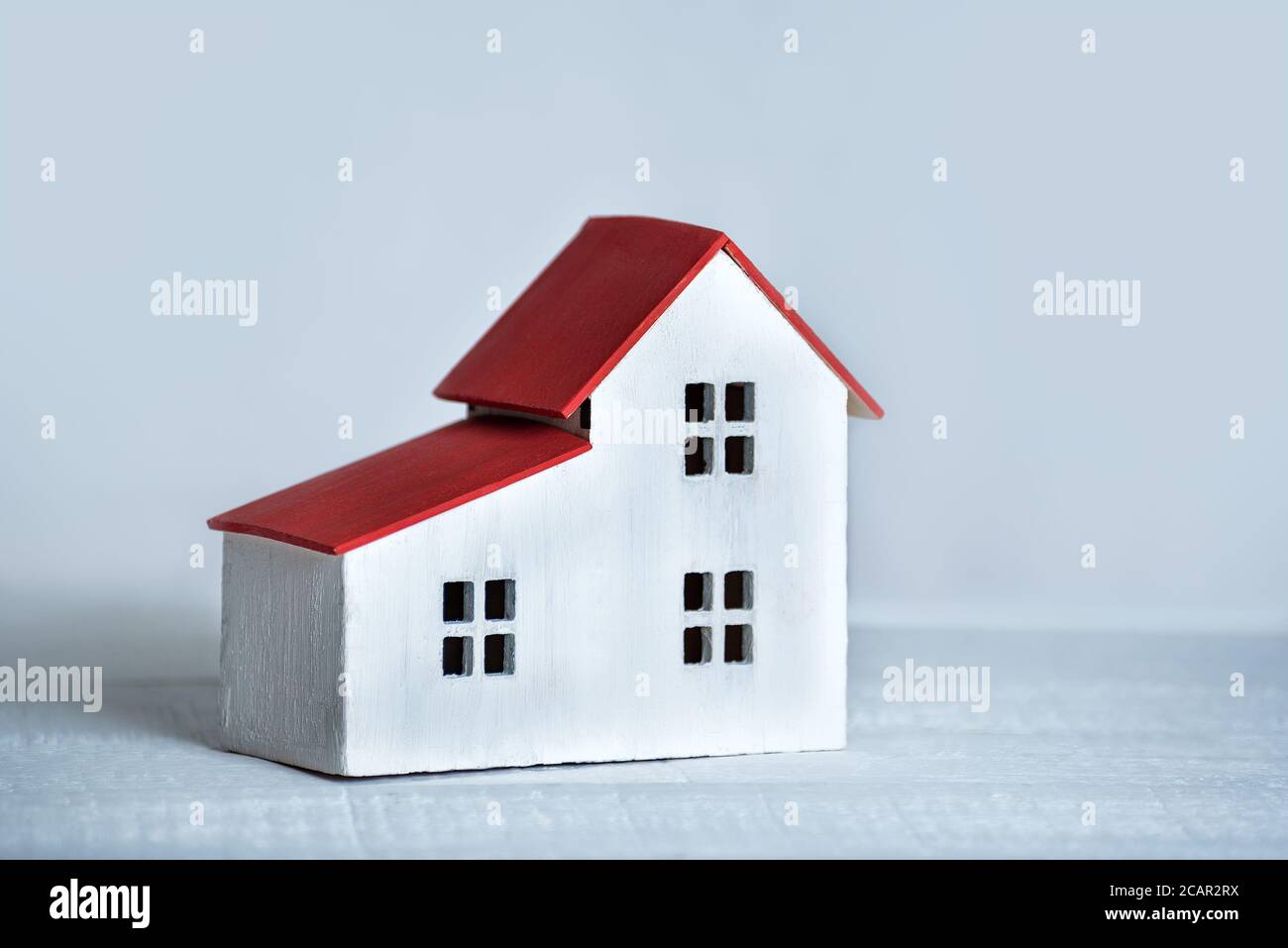 Model home on white background. Buying house mortgage concept. Closeup ...