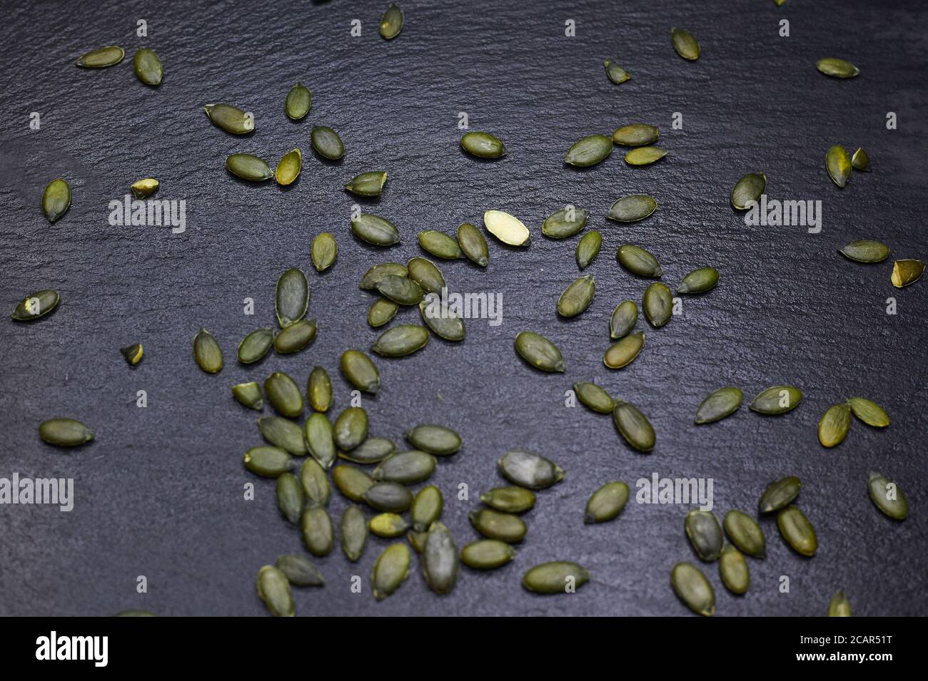 Shelled sunflower seeds on green hi-res stock photography and images ...