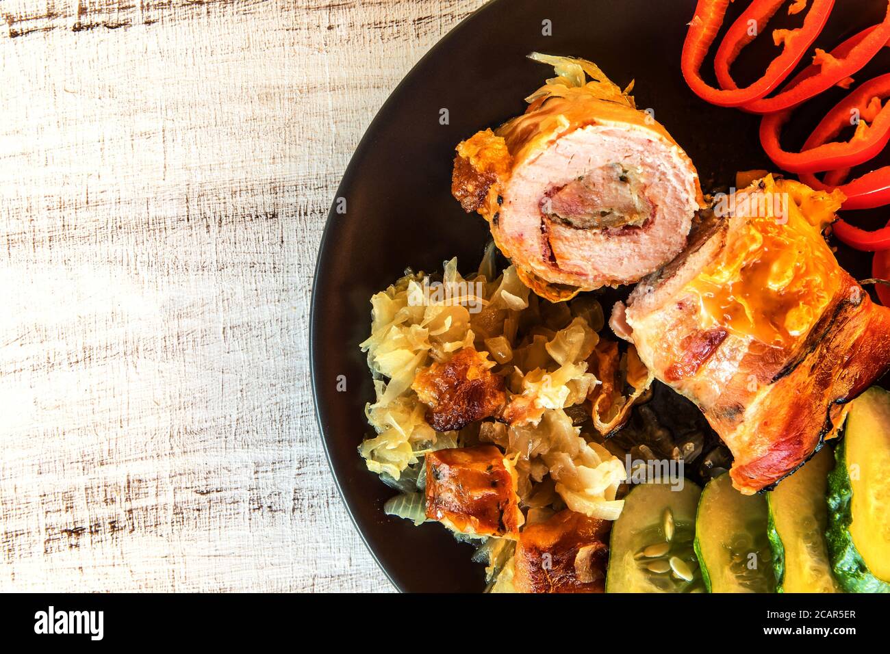 Roasted Pork Roll stuffed with sausage wrapped bacon and Cheese. Pork ...