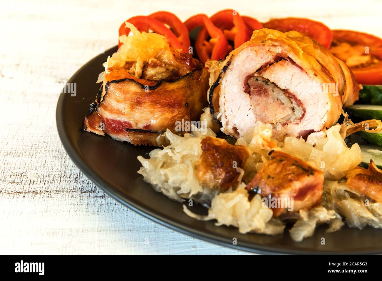 Roasted Pork Roll stuffed with sausage wrapped bacon and Cheese. Pork ...