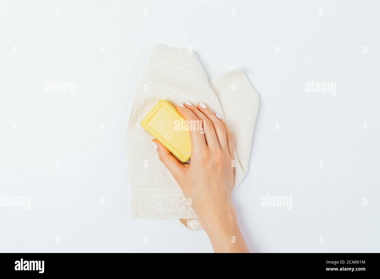 Personal hygiene rule wash your hands. Woman's hand takes bar of soap ...