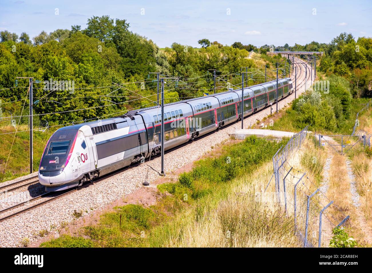 A TGV inOui high speed train from french rail company SNCF is driving from Lille to Paris on the ...