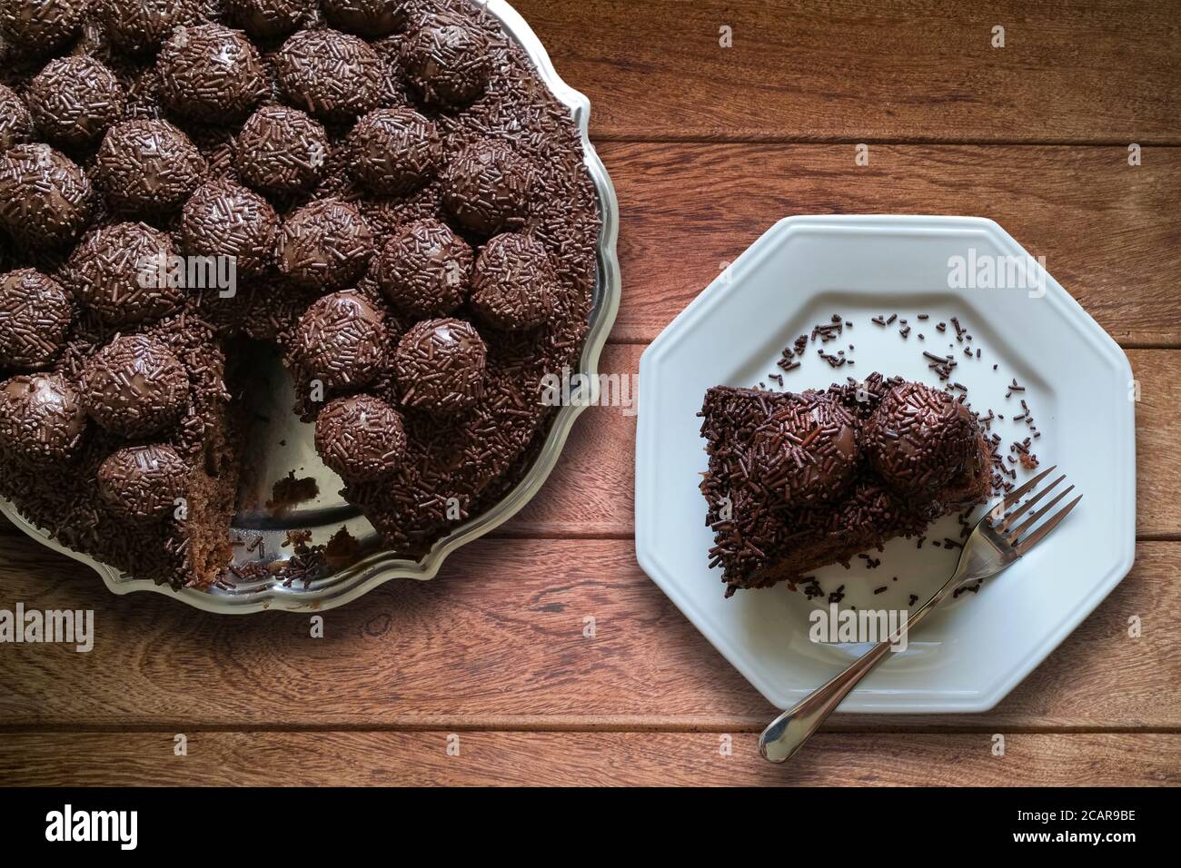 Brigadeiro cake. Traditional Brazilian sweet. Isolated on wooden ...