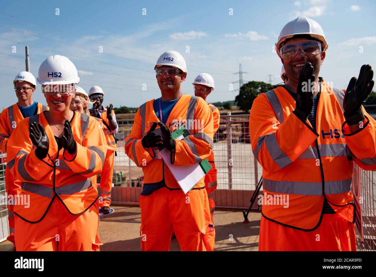 HS2 workers react as a bridge is wheeled into position over the M42 at ...