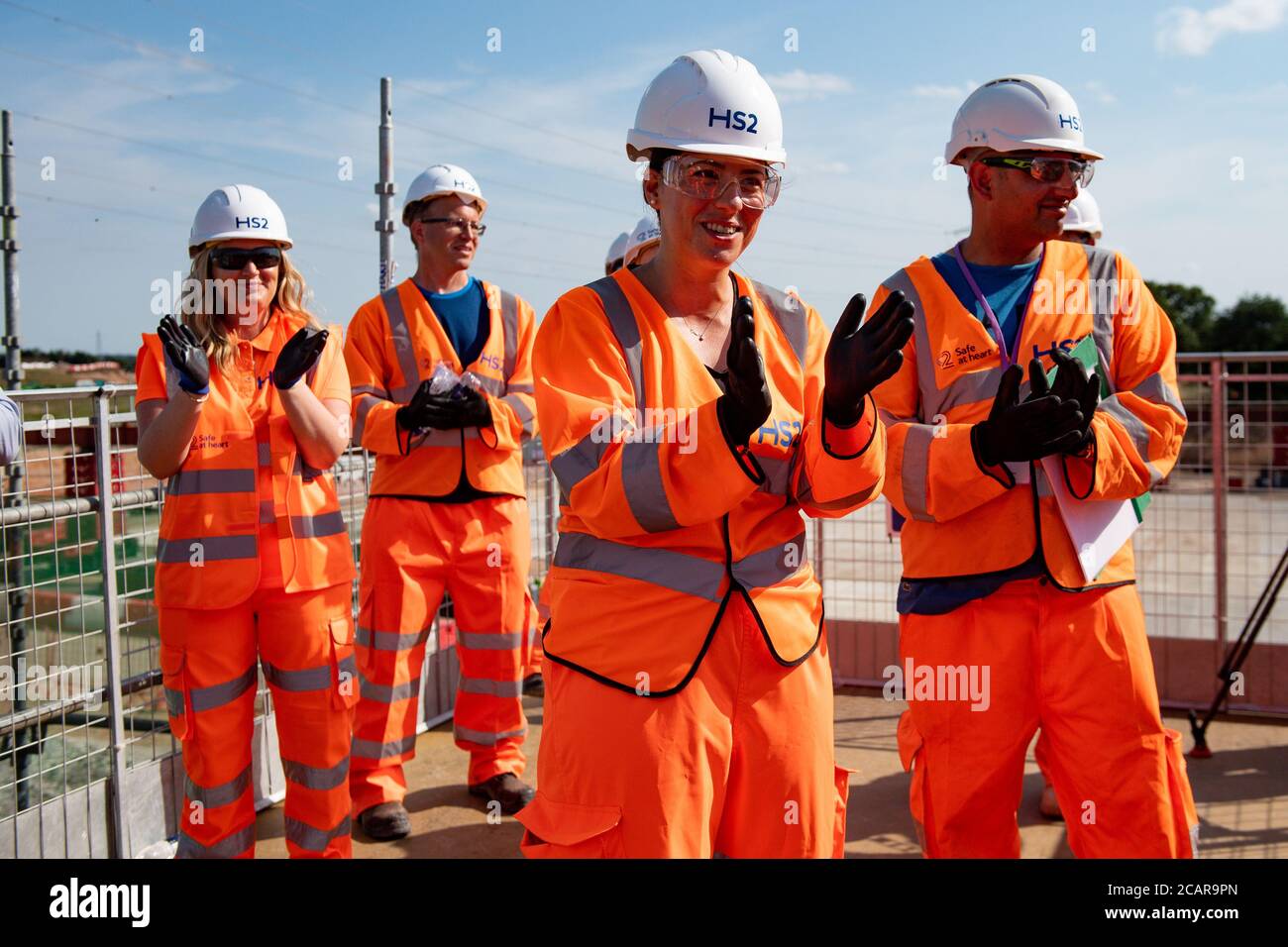 HS2 workers react as a bridge is wheeled into position over the M42 at ...