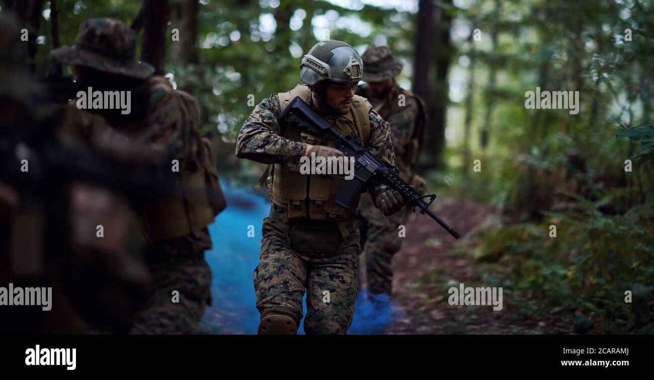 Modern warfare Soldiers Squad Running as Team in Battle Formation Stock ...