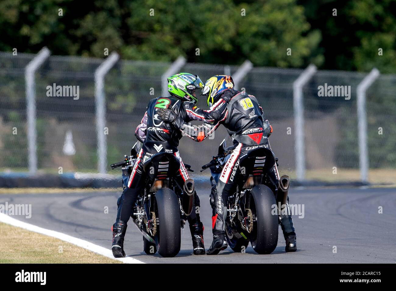 Honda Racing's Andrew Irwin (right) celebrates with his brother Glenn ...