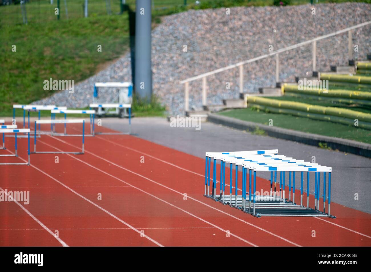 An empty outdoor running track with metal running barriers Stock Photo ...