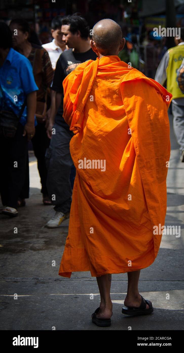 Buddhist monk walking Stock Photo - Alamy