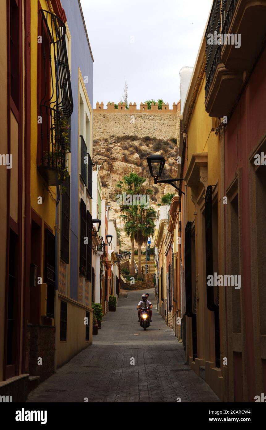 Colorful narrow street below the Alcazaba in the center of Almería ...