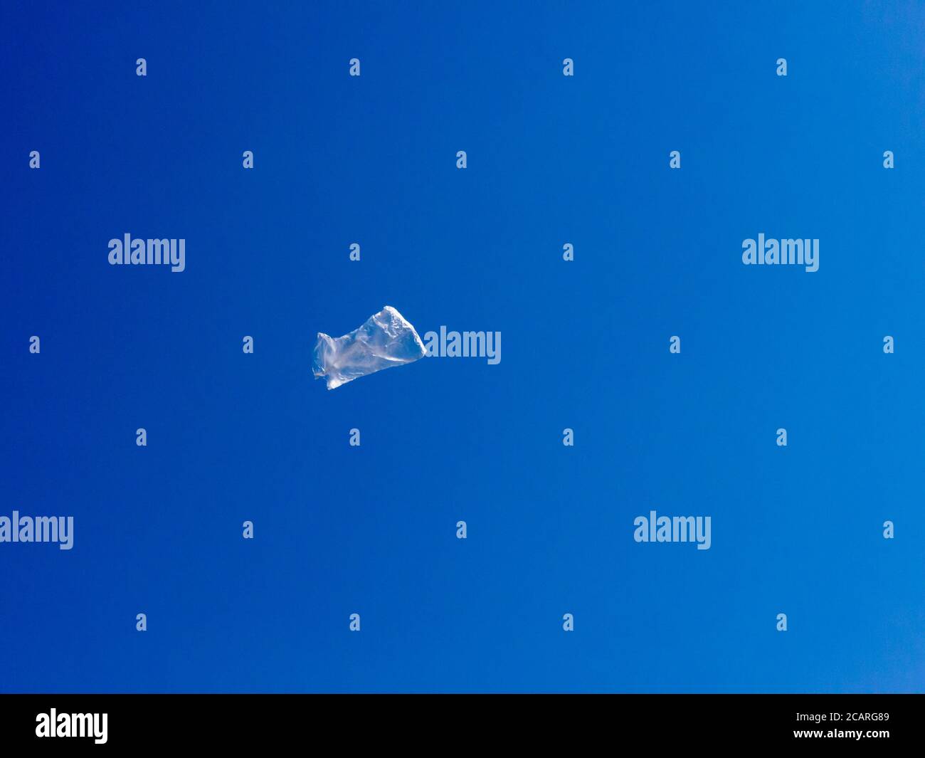 Blue sky and flying package Stock Photo - Alamy