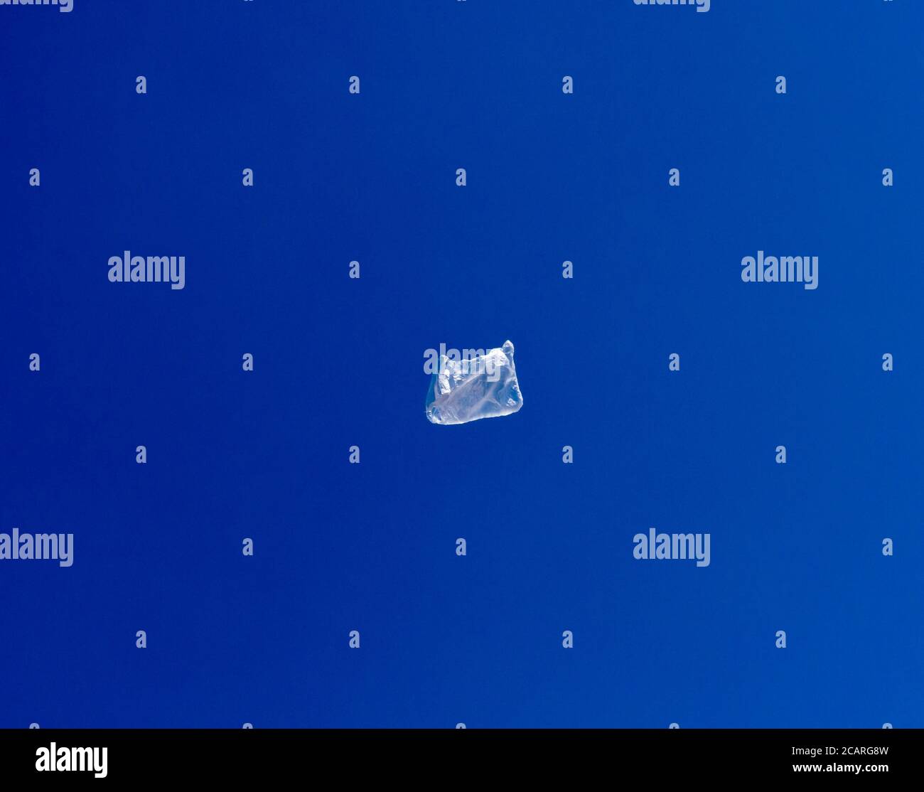 Blue sky and flying package Stock Photo - Alamy