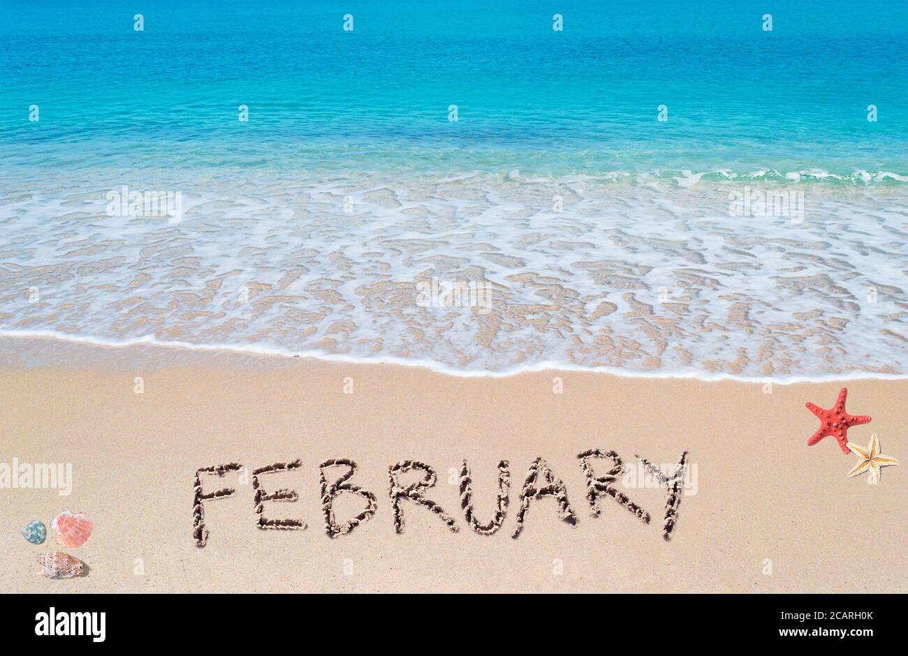 february written on a tropical beach Stock Photo - Alamy