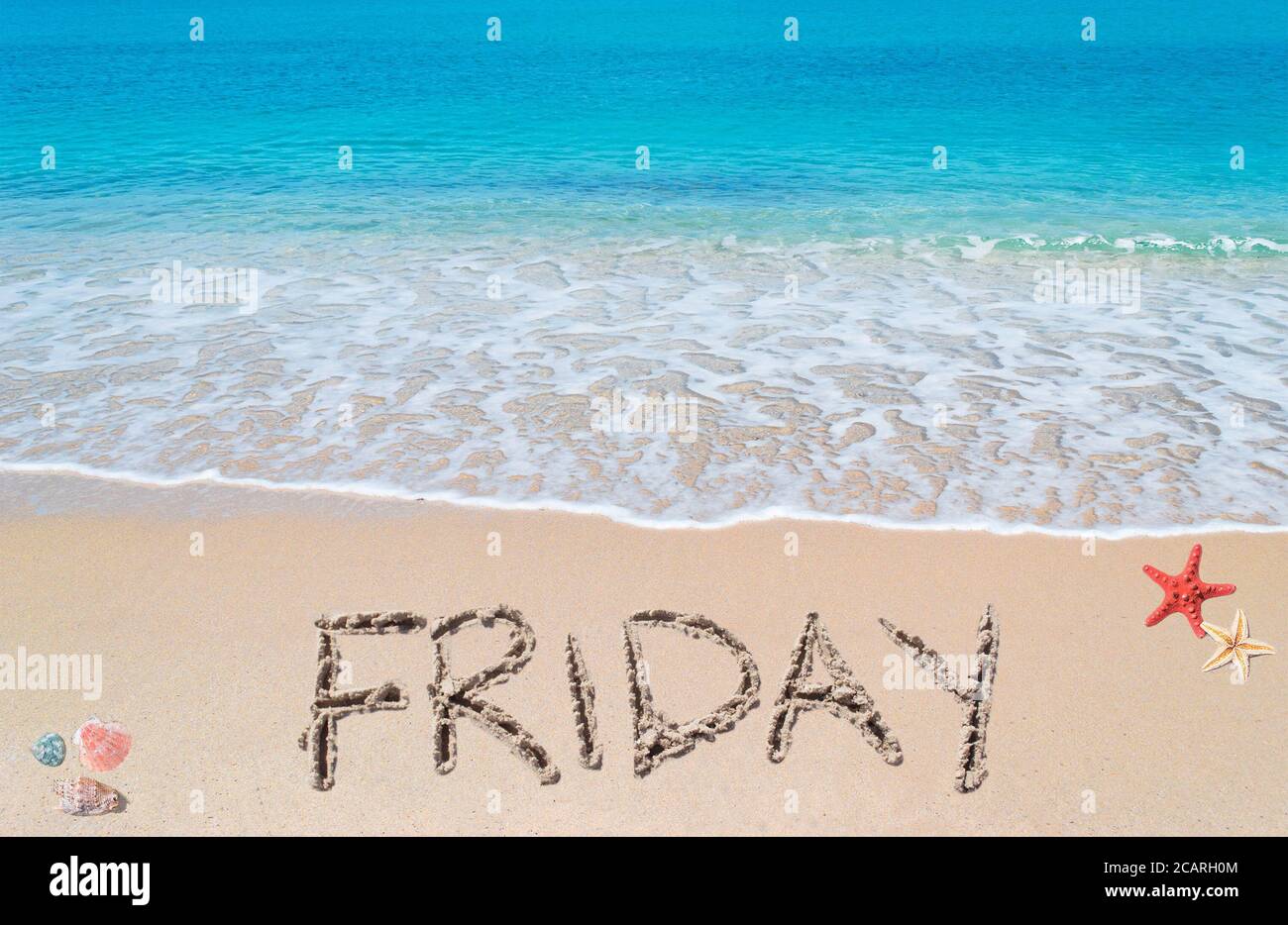 friday written on a tropical beach Stock Photo - Alamy