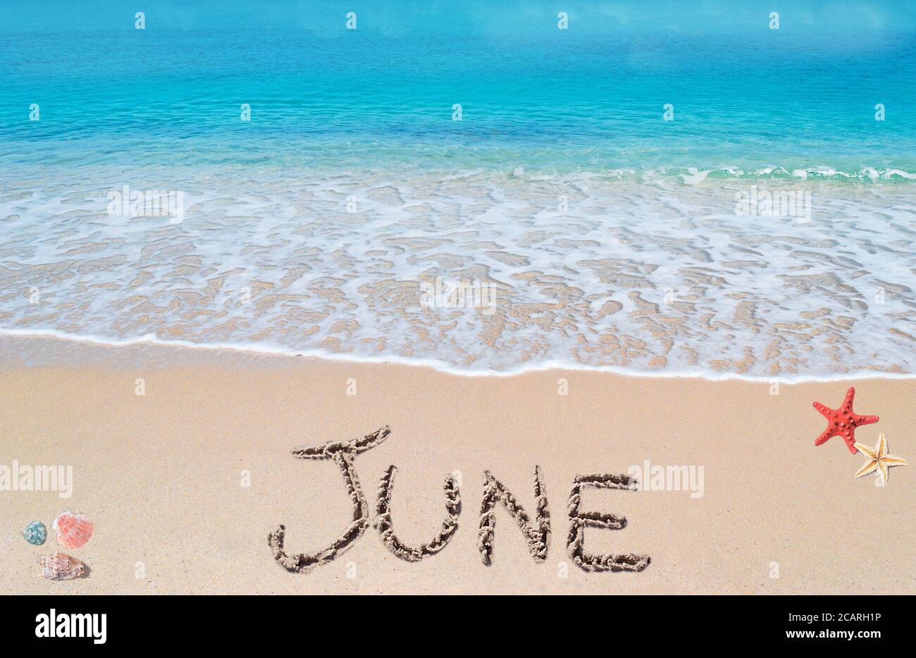 june written on a tropical beach Stock Photo - Alamy