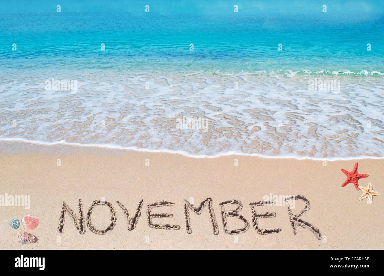 november written on a tropical beach Stock Photo - Alamy