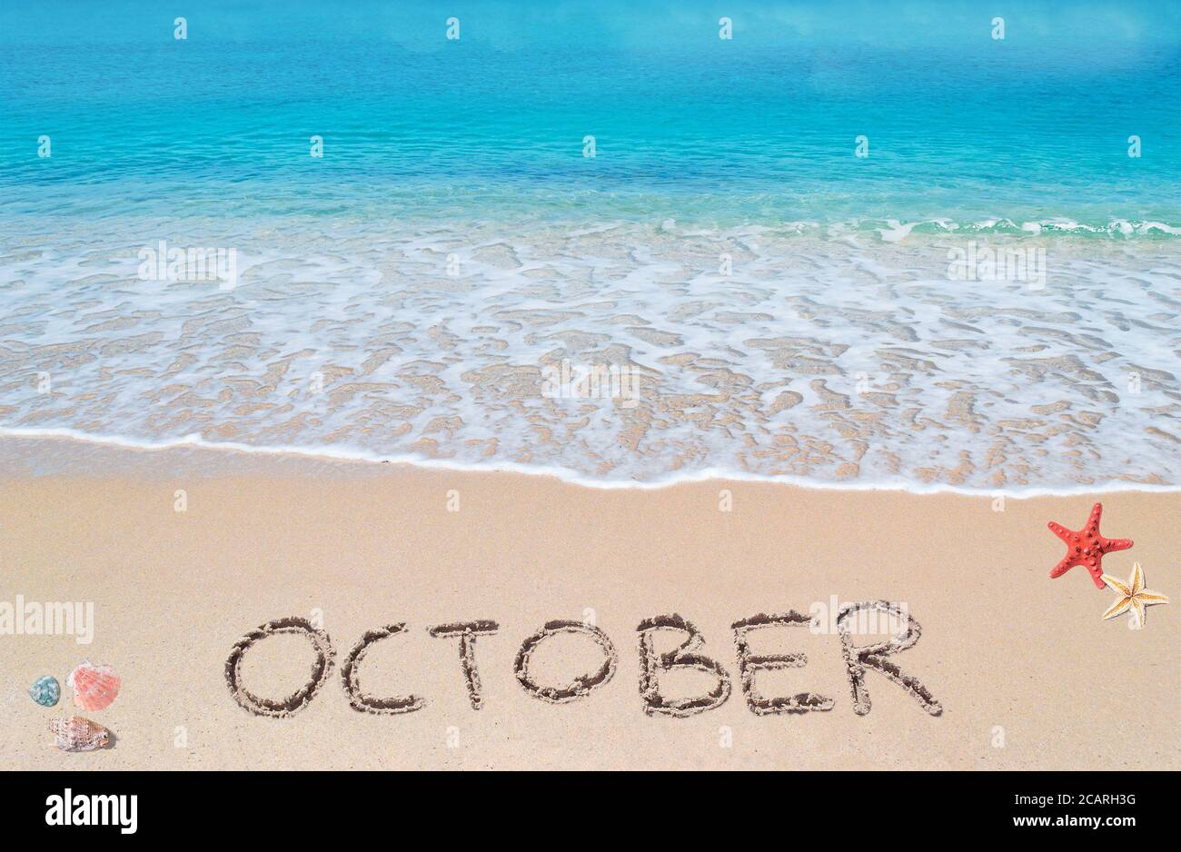 october written on a tropical beach Stock Photo - Alamy