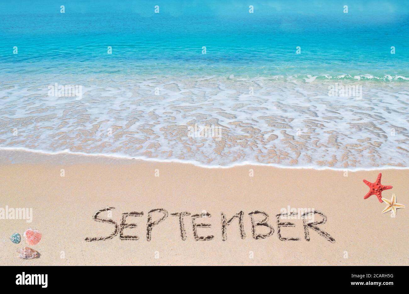 september written on a tropical beach Stock Photo - Alamy