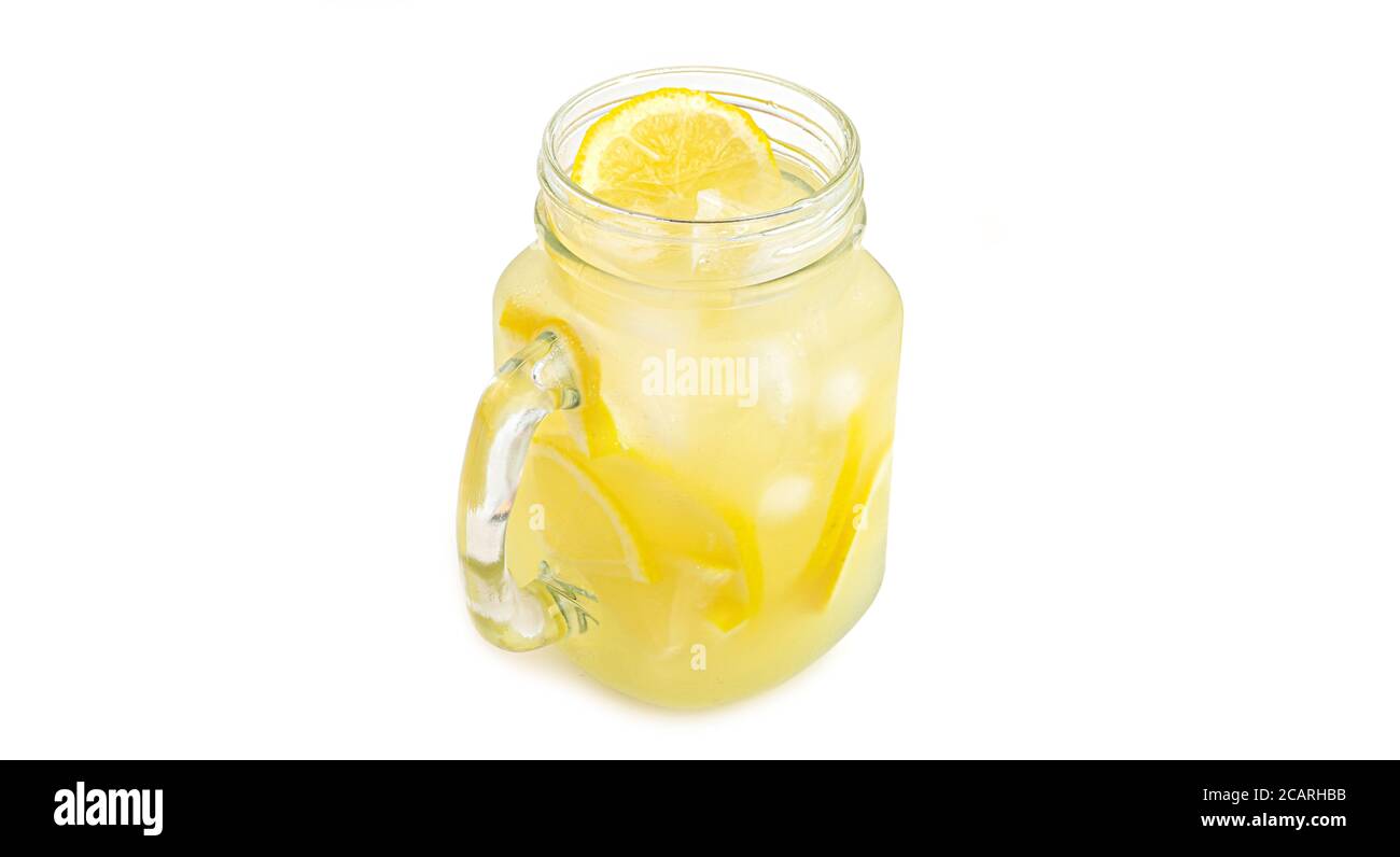 Mason jar with lemonade and ice on white background. Macro photo Stock ...