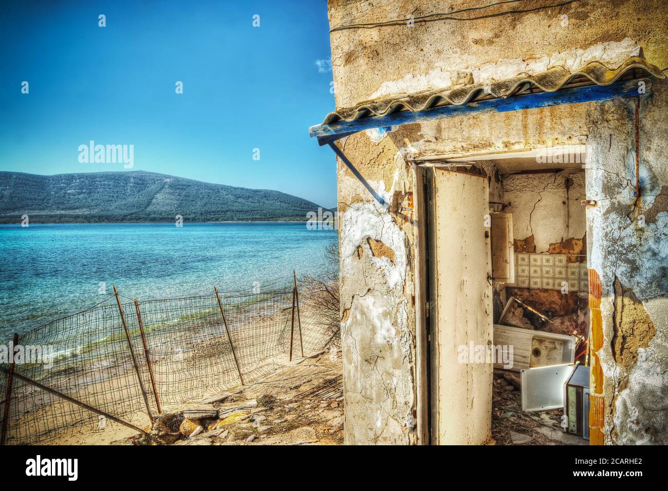 old ruins by the sea in Mugoni beach, Sardinia. processed for hdr tone ...