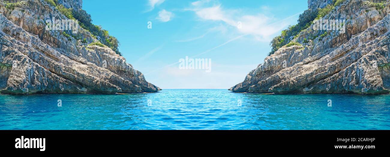 narrow pass through two cliffs in the sea Stock Photo - Alamy