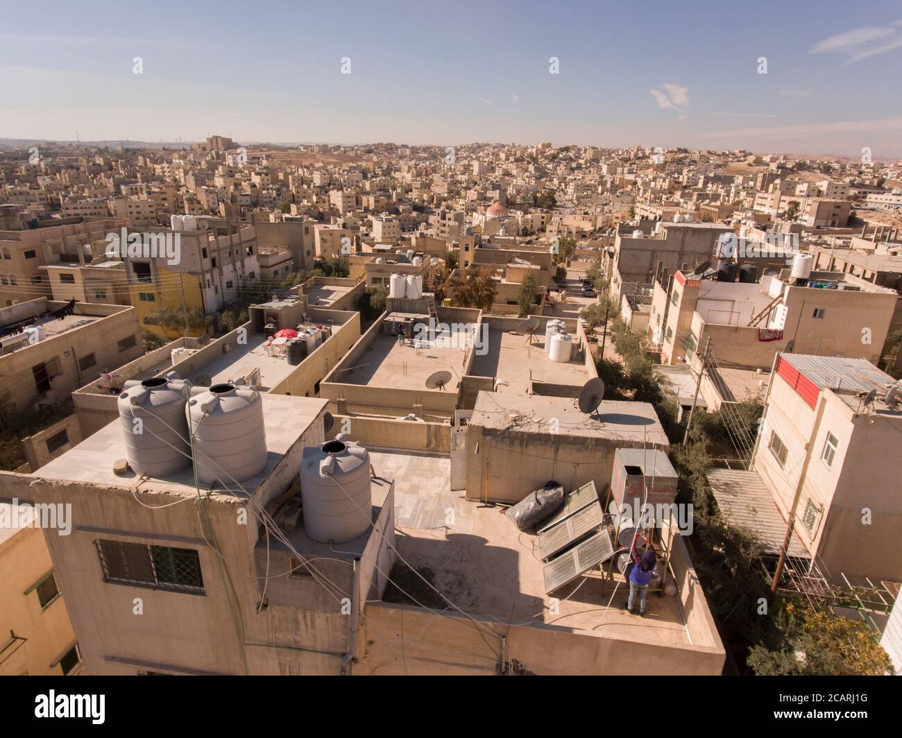 Rooftop water tanks are a common sight in the arid, sprawling city of ...