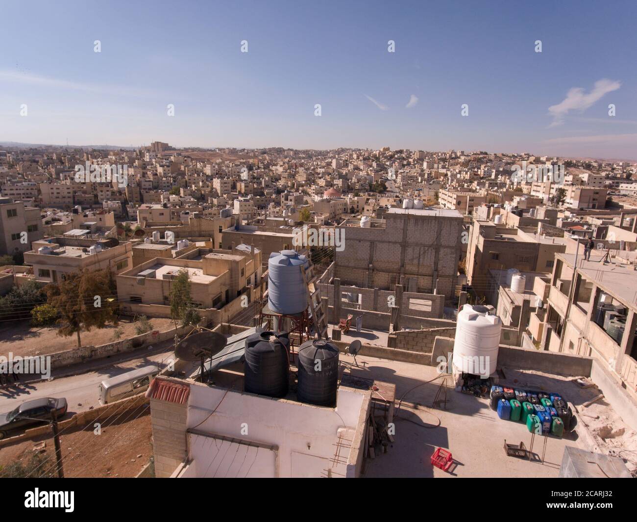 Rooftop water tanks are a common sight in the arid, sprawling city of ...