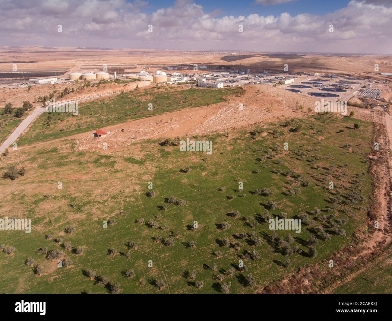Green fertile fields surround the As-Samra wastewater treatment plant ...