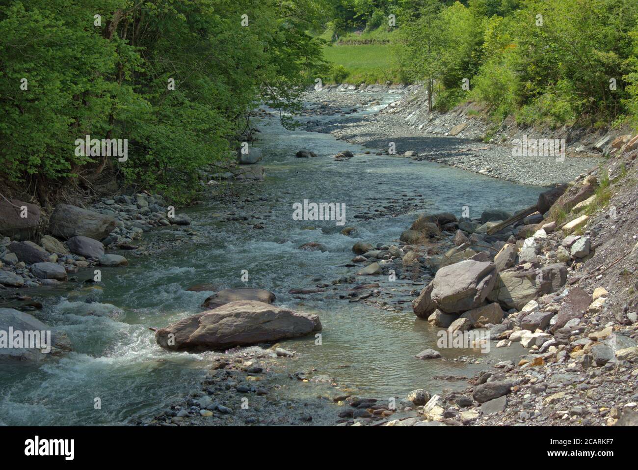 Small alpine river in Switzerland Stock Photo - Alamy