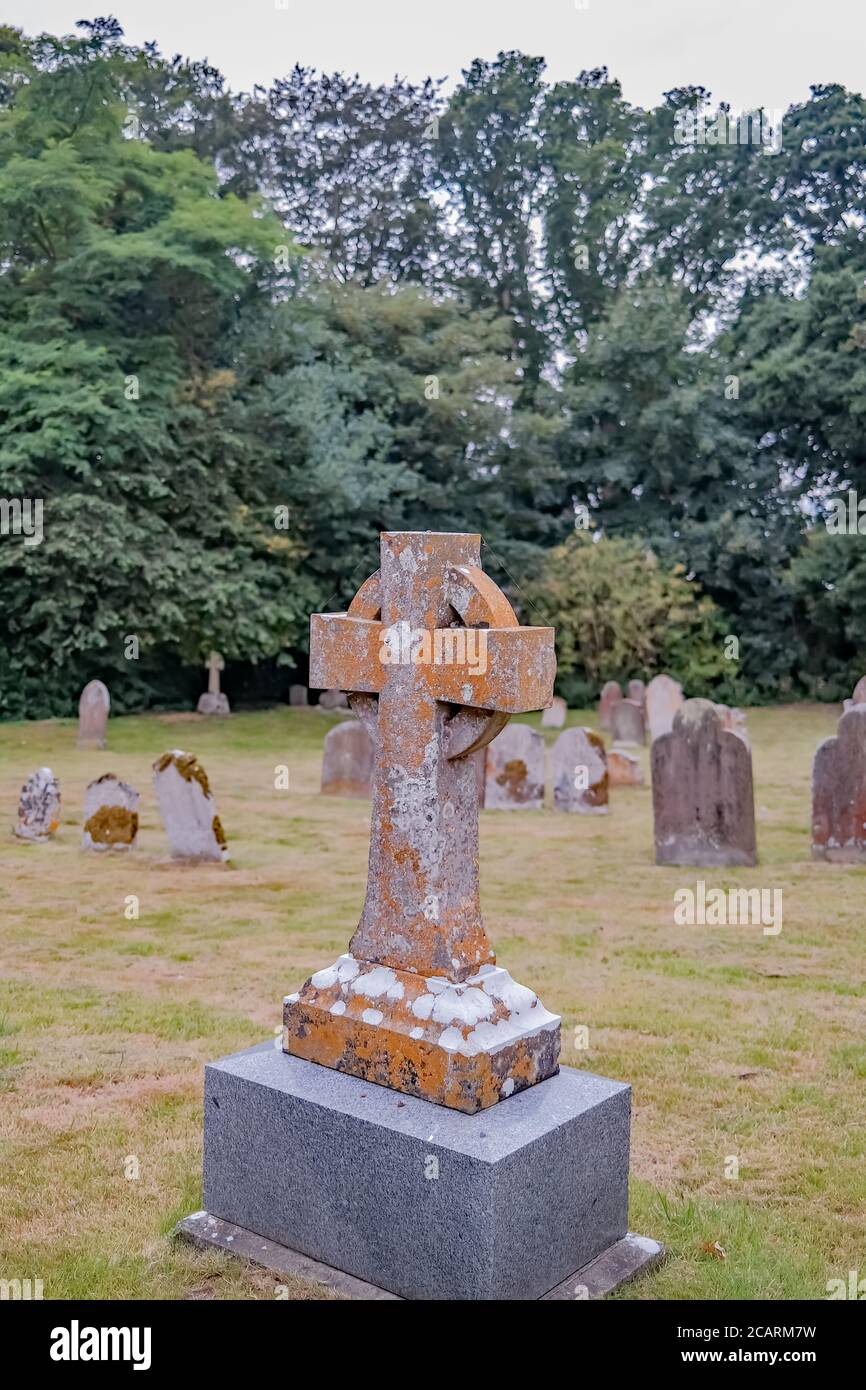 Ornate concrete cross in the church yard in the Norfolk village of ...