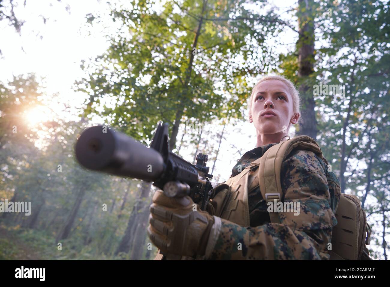 woman soldier ready for battle wearing protective military gear and ...