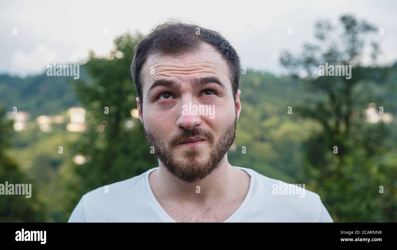 Young white-skinned handsome man with unstable problems in nature Stock ...