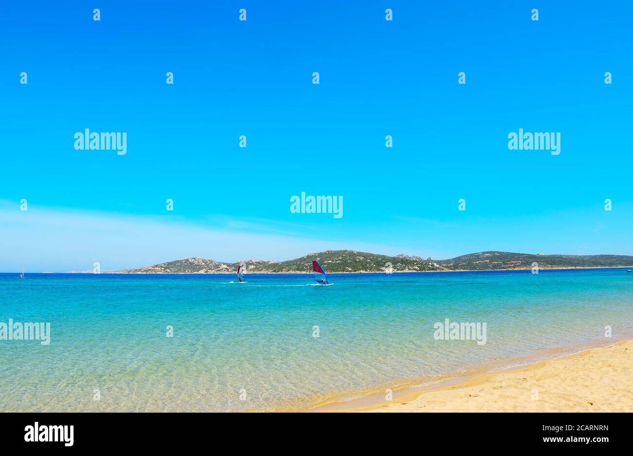 windsurfing in Porto Pollo beach, Sardinia Stock Photo - Alamy