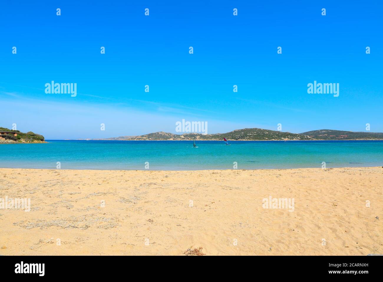 widnsurfing in Porto Pollo beach, Sardinia Stock Photo - Alamy