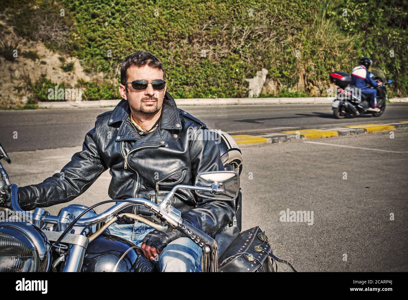 biker on a classic motorcycle in sepia tone effect Stock Photo - Alamy