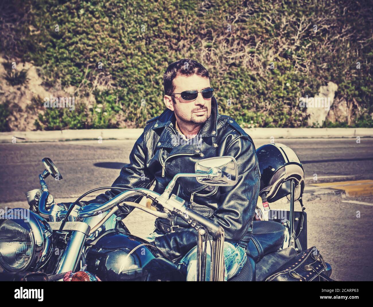 biker on a classic motorcycle in sepia tone effect Stock Photo - Alamy