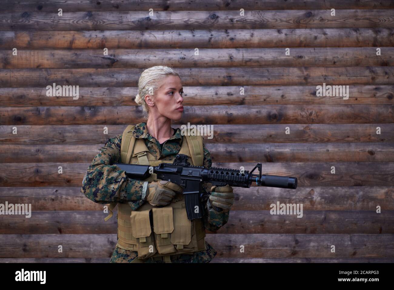 woman soldier ready for battle wearing protective military gear and ...