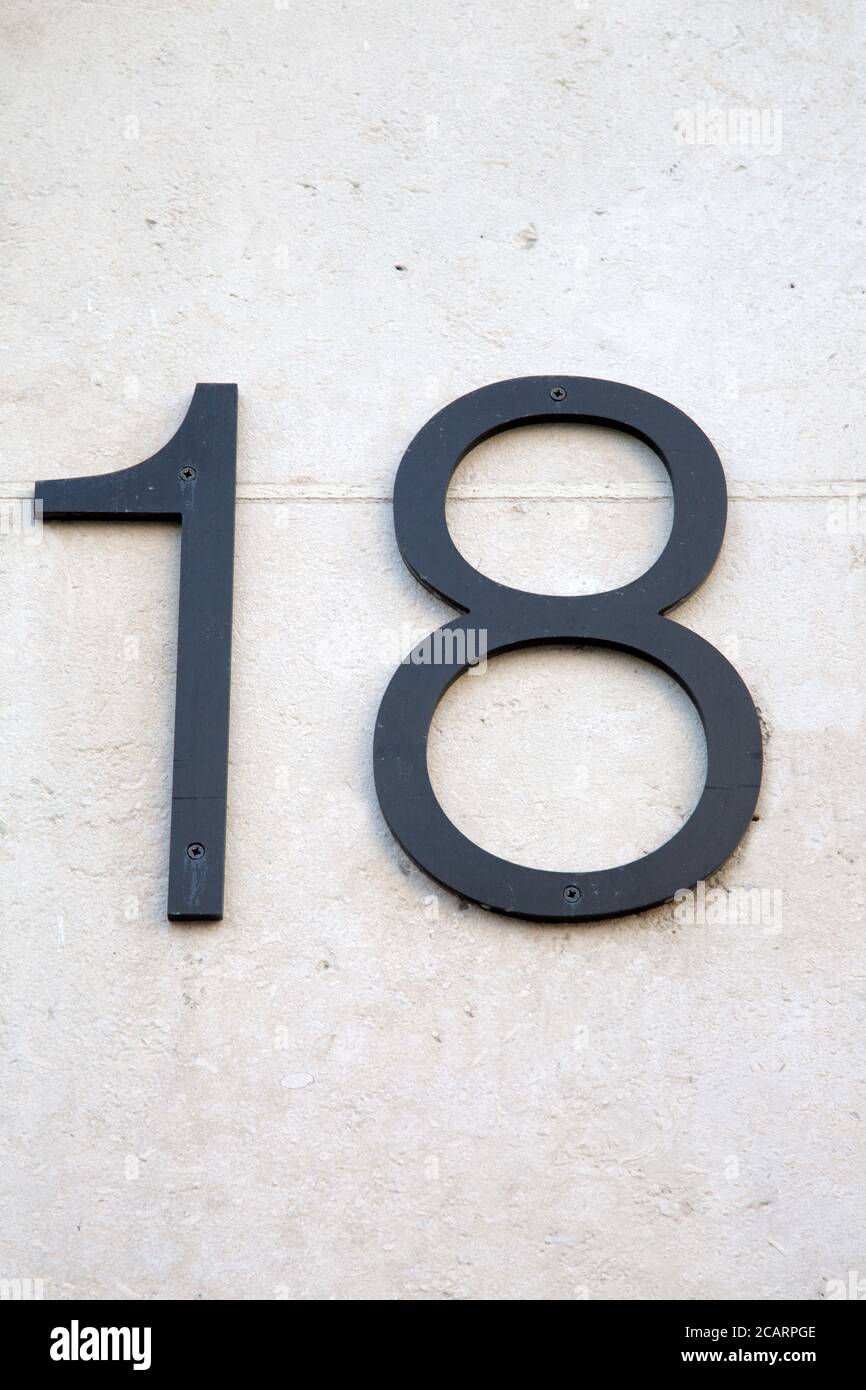 Number Eighteen Sign on Stone Wall Stock Photo - Alamy