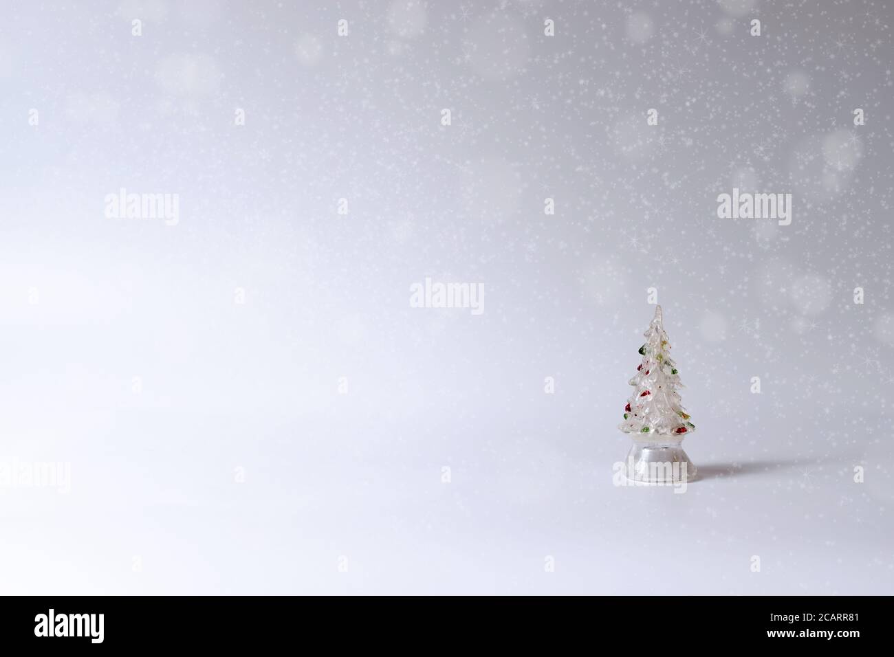 Poster with a toy tree, empty space background for text. Light colors ...